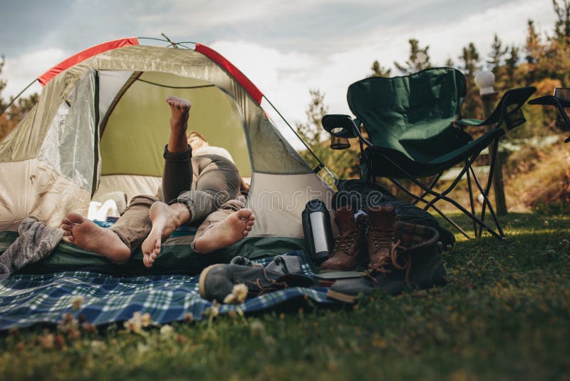 Romantic Camping A Young Couple Sitting By The Bonfire Stock Image