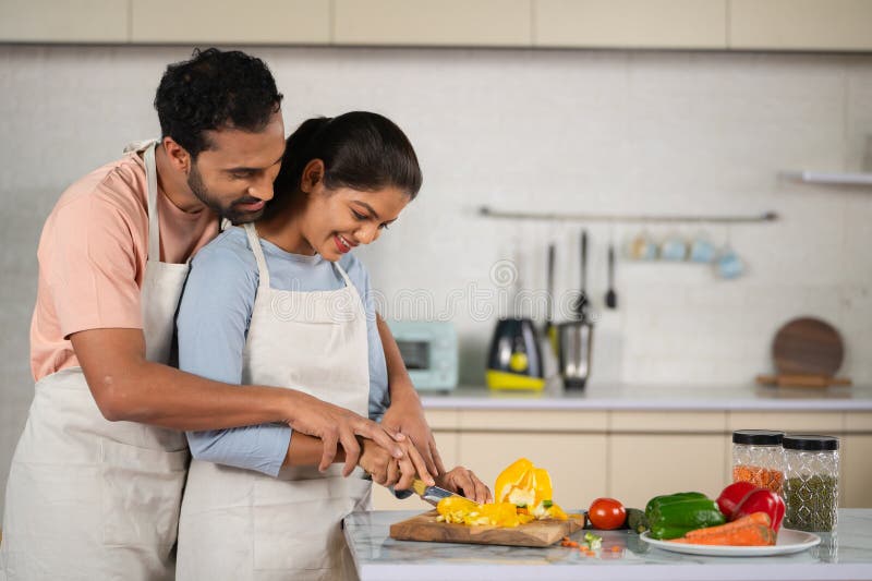 Romantic Young Couples Cooking Together by Chopping Vegetables at ...