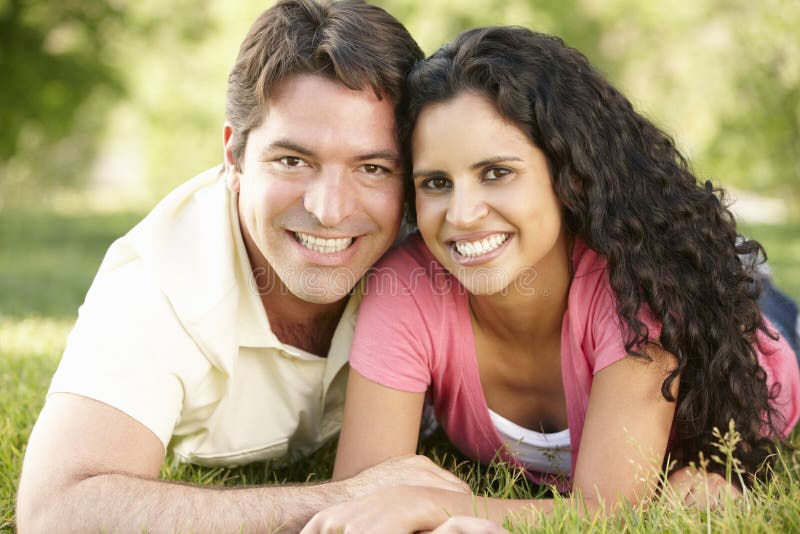Romantic Young Hispanic Couple Relaxing in Park Stock Image - Image of ...