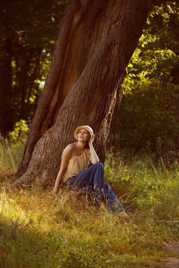 Romantic Young Woman Sitting Under a Tree Stock Photo - Image of nature ...