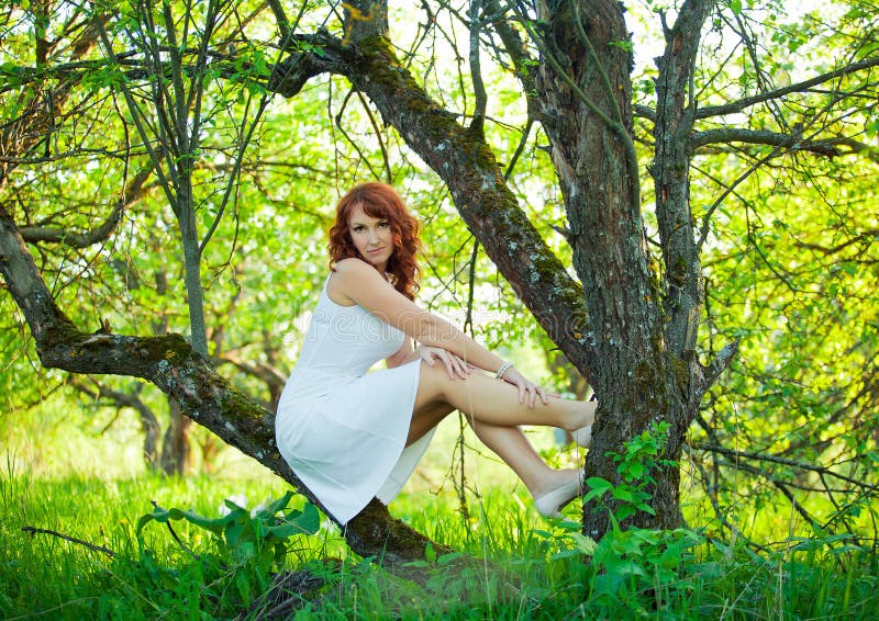 Romantic Young Woman in the Spring Garden among Apple Blossom. Stock ...