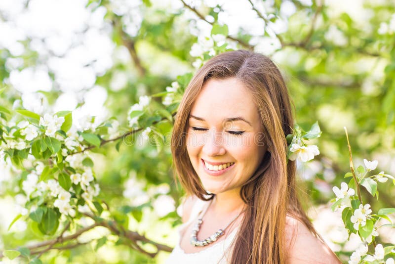Romantic Young Woman in the Spring Garden among Apple Blossom, Soft ...
