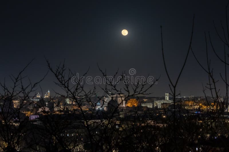 Rome city skyline at night stock photo. Image of moon - 211984086