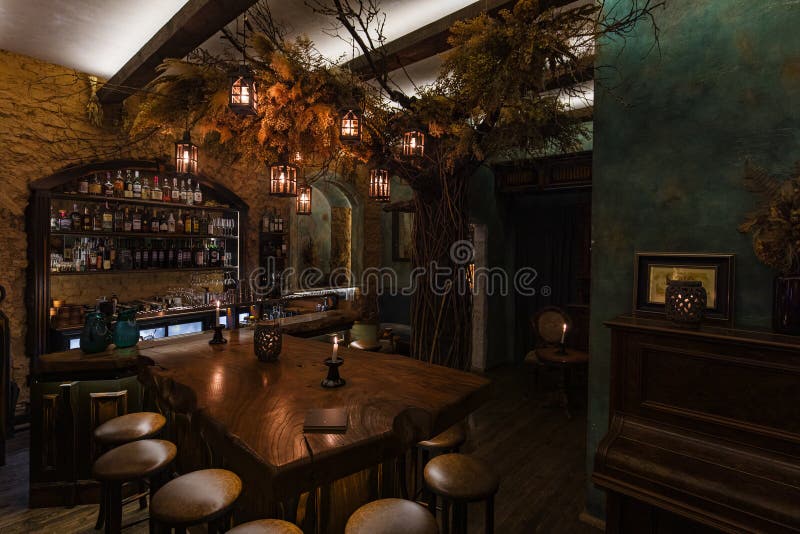 ROME, ITALY - APRIL 09 2022: Rustic Table and Stools Under Tree with ...