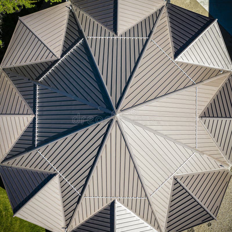 The Roof of a Building is Covered in Metal and Has a Diamond Shape ...