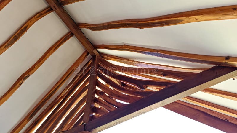 The Roof of a Building is Made of Wood and Has a Slanted Design Stock ...