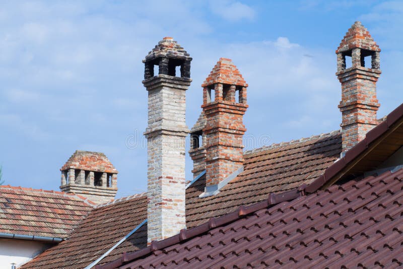 Five Chimneys On A Smokehouse With Blue Sky Stock Image - Image of ...