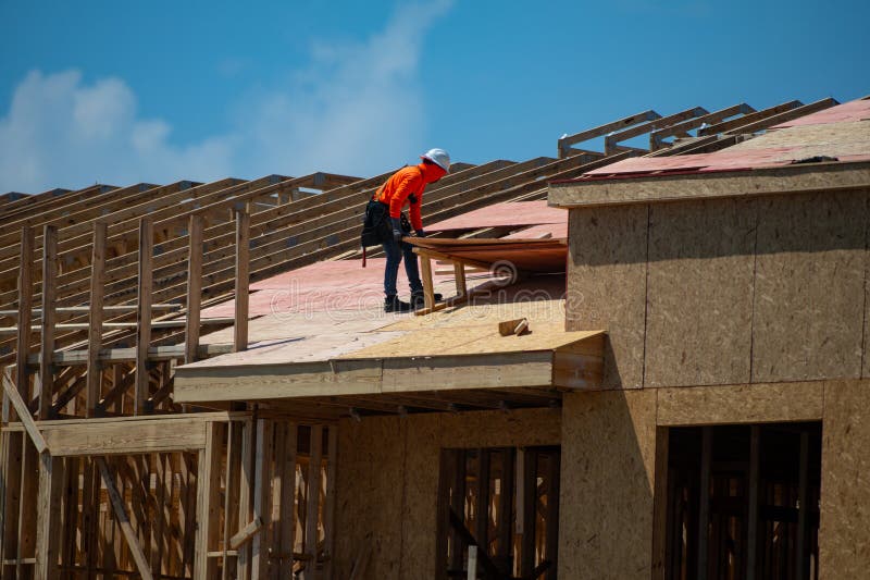 Roof Construction. Roofer on Roof Structure. Construction Worker on Top ...