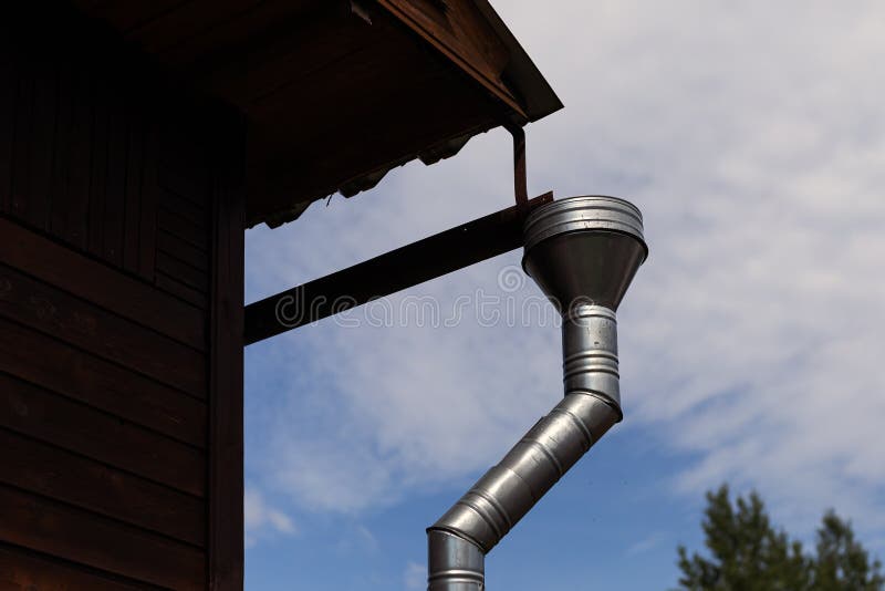 Roof Edge of a Small House with Installed Rainwater Drainage System ...