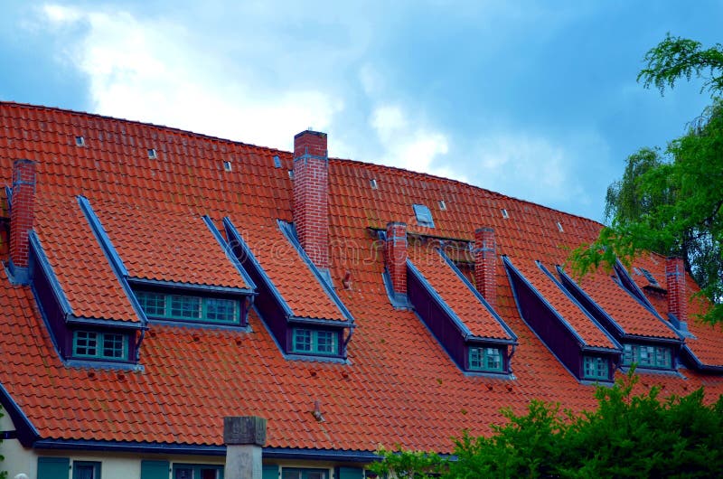 Roof Of A Medieval House With Dormer Roof Tiles And Fireplace With ...