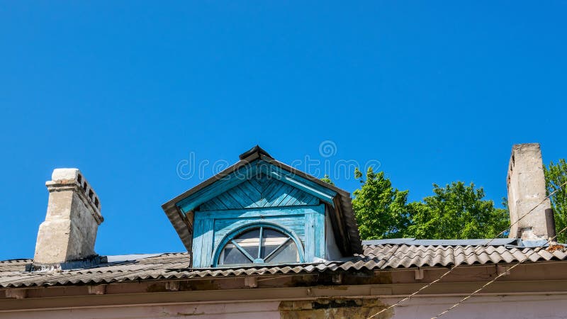 Roof of an Old House with Dormer Window and Chimneys Stock Photo ...
