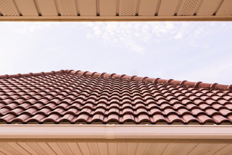 Roof Tiles and Rain Gutter Horizontal View Against Blue Sky Stock Photo ...