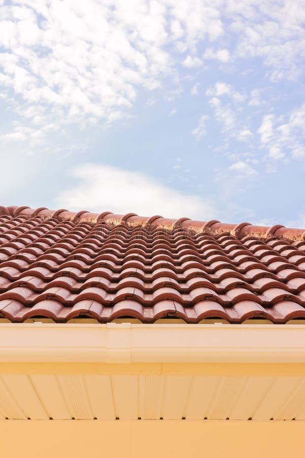 Roof Tiles , Rain Gutter and Windows Against Blue Sky Stock Image ...