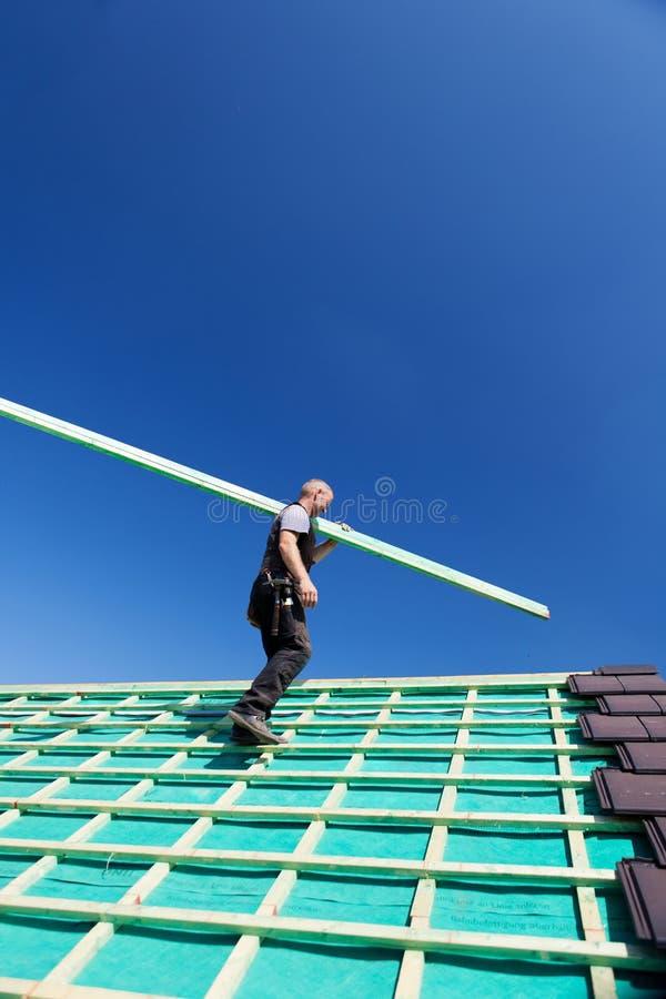Roofer Climbing the Roof with a Beam Stock Image - Image of framework ...