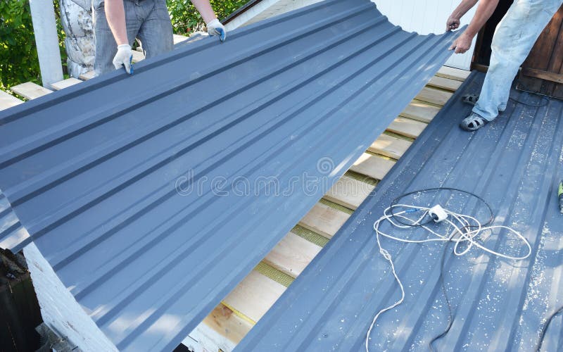 Roofer Constructors Laying Lightweight Metal Roofing Sheet on New House ...