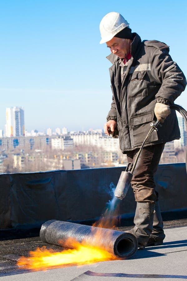Roofer Worker Installing a Roll of Roofing Felt Stock Image - Image of ...
