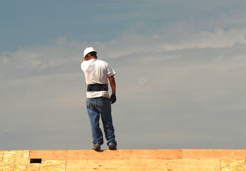 Roofer working on a roof stock photo. Image of construction - 3079482