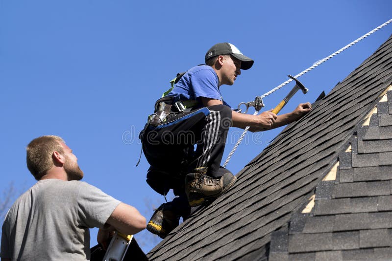 Roofers on a Steep Pitch editorial stock photo. Image of hammer - 71294638