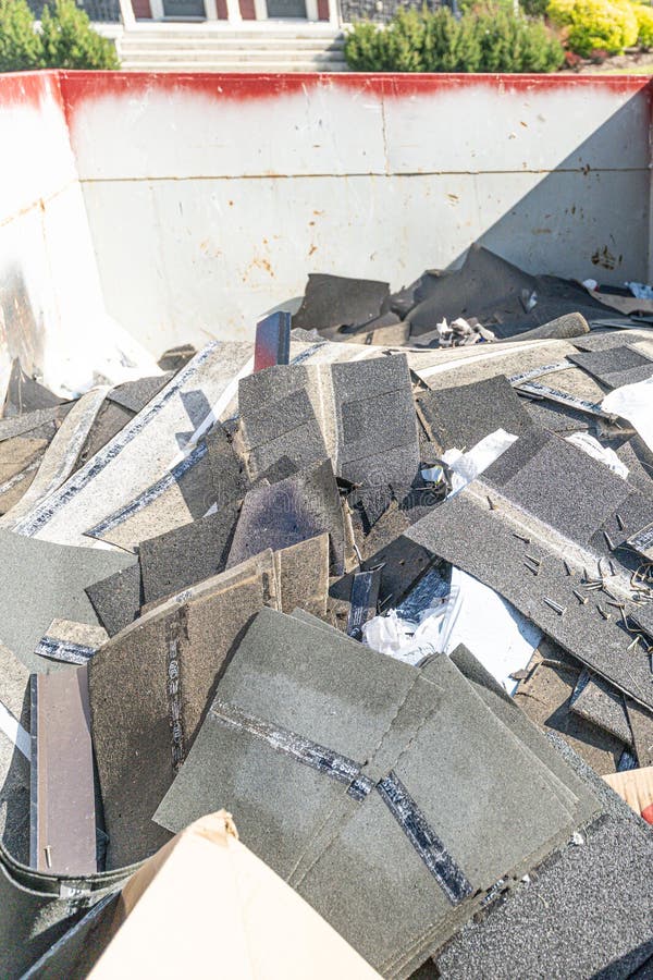 Roofing Shingles Damaged by Hailstorm in Garbage Bin Stock Photo ...