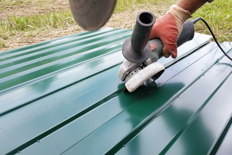 During the Roofing Work, a Construction Worker Sprays a Steel Sheet ...
