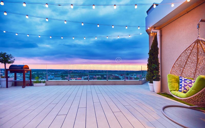 Rooftop Deck Patio Area with Hanging Chair on a Sunset Stock Photo ...