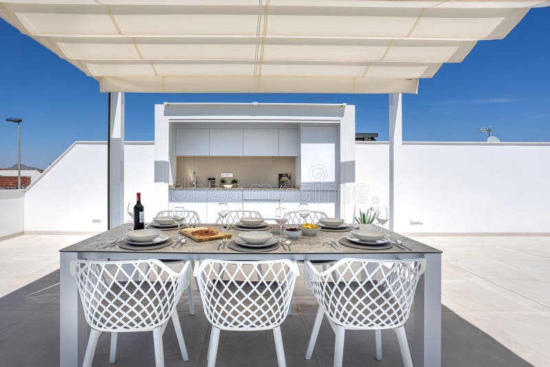 Rooftop Dining Area with Outdoor Kitchen Editorial Photography - Image ...