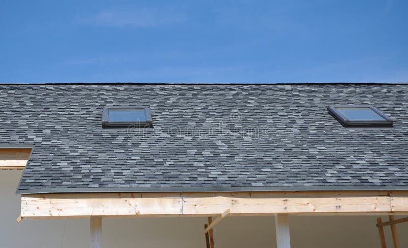 Rooftop House Construction with New Attic Skylight Windows and Asphalt ...