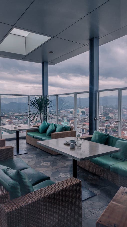 Rooftop Lounge with Cloudy Sky and Gorgeous City View Stock Photo ...