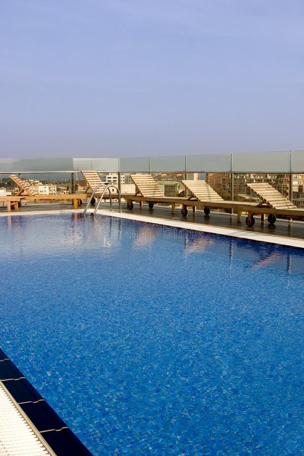 Rooftop Pool Overlooking City Building Stock Image - Image of water ...