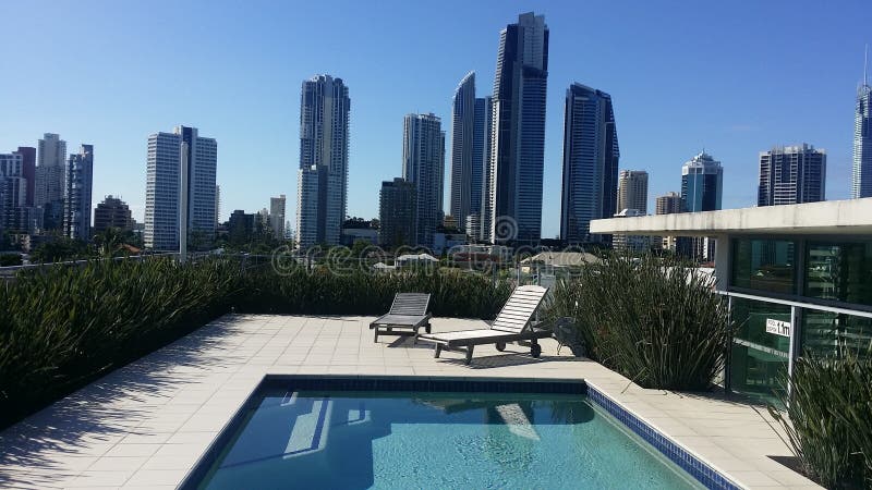 Rooftop pool skyline stock photo. Image of skyline, surfers - 66329364