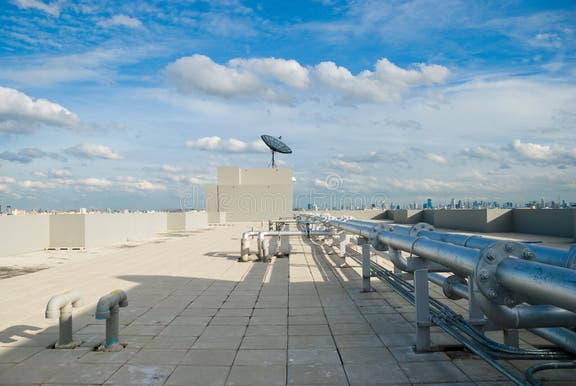 Rooftop with Satellite Dish and Pipe Lines Stock Image - Image of ...