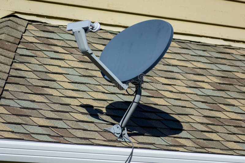 A Rooftop Satellite Dish Securely Attached To a Sloped, Shingled Roof ...