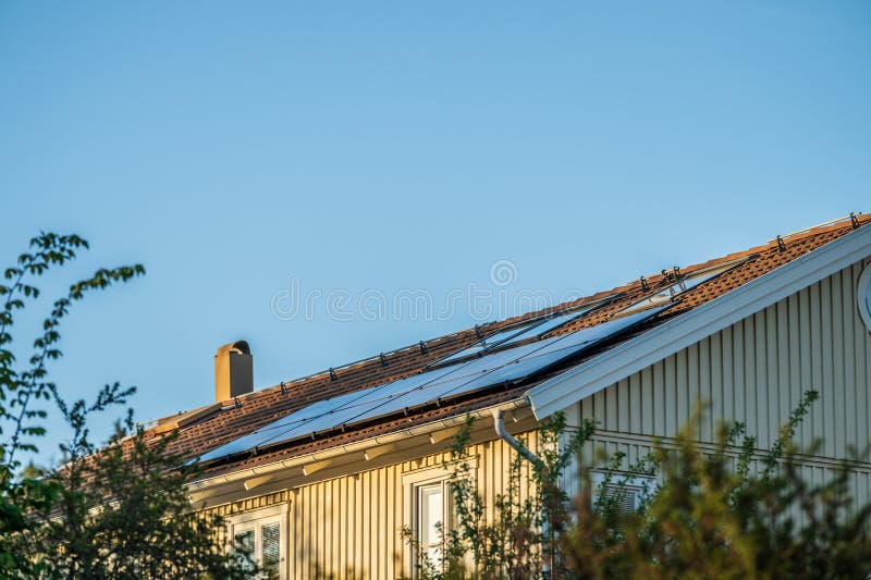 Rooftop Solar Panels on Yellow Wooden House.. Stock Image - Image of ...