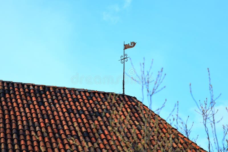 A Rooftop with a Weather Vane on Top, Suitable for Architectural or ...