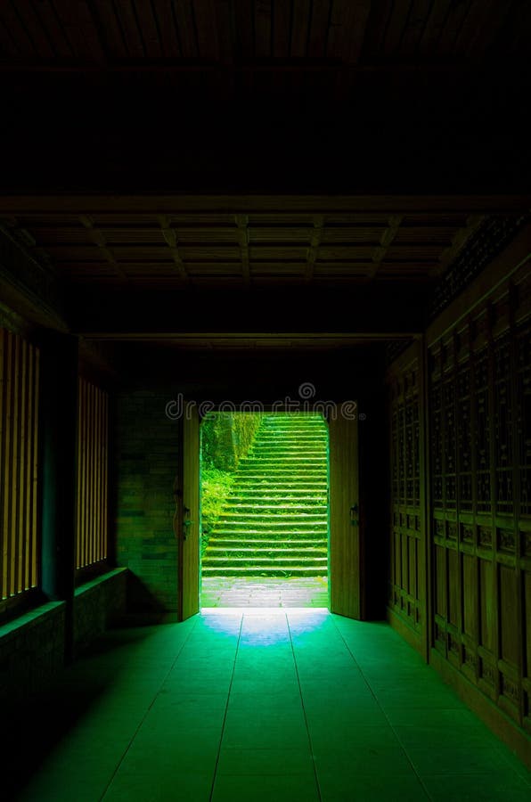 A Room that Has Two Open Doors Next To Stairs and Lights Stock Image ...