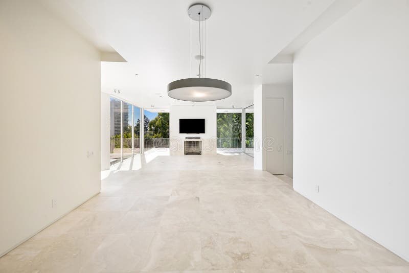 Room with Multiple Spacious White Walls and Long Hallway Stock Image ...