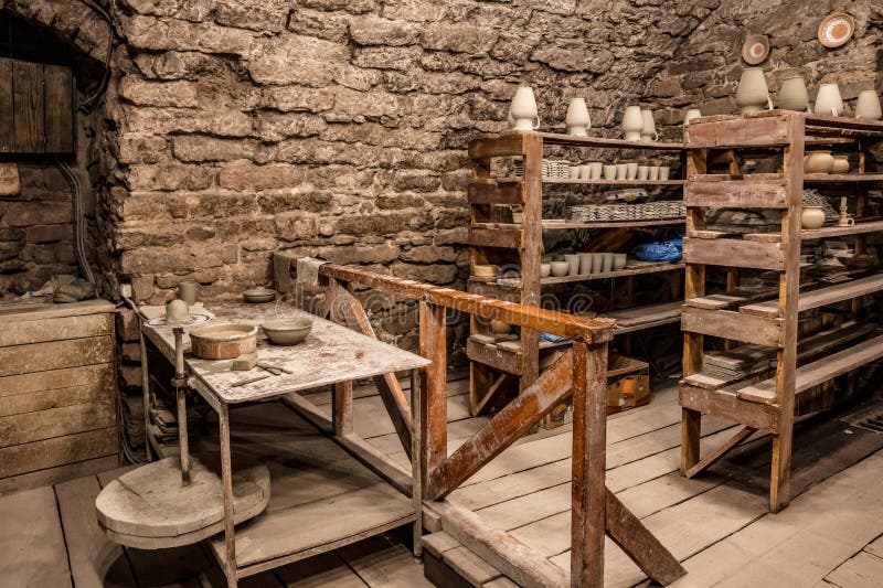 A Room with a Table and Shelves Full of Pottery Stock Photo - Image of ...