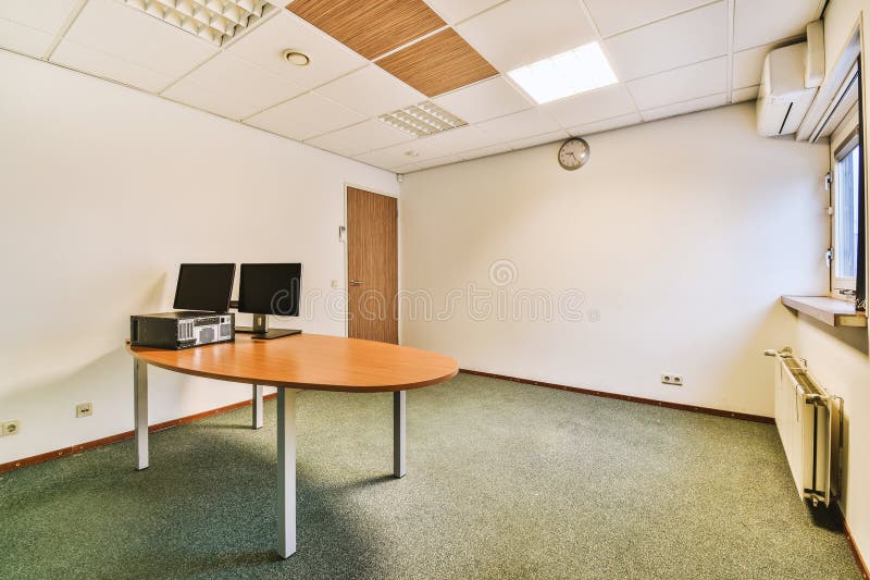 A Room with a Table with Two Monitors on it Editorial Stock Photo ...