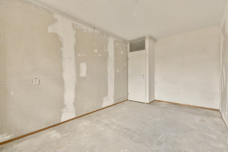 A Room with Unfinished Walls and a Door in it Stock Photo - Image of ...