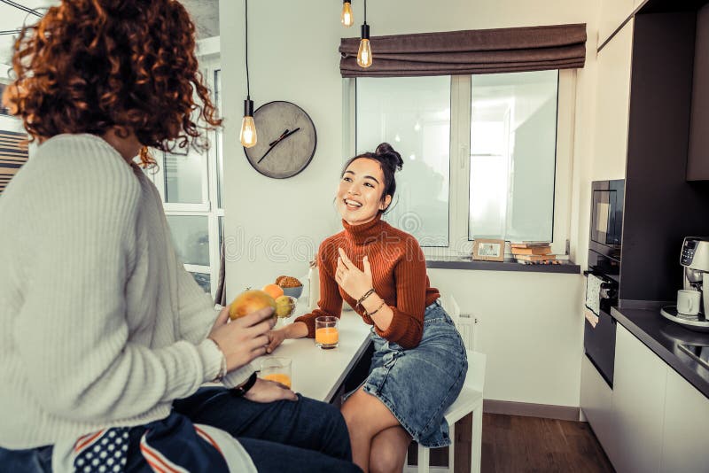 Roommates Feeling Involved in Conversation in the Kitchen Stock Photo ...