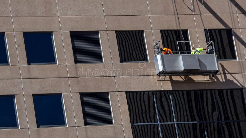 The Rope Access Building Window Cleaner. Stock Image - Image of ...