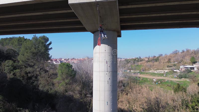 Rope Access Technician Inspecting Bridge Pylon Stock Video - Video of ...