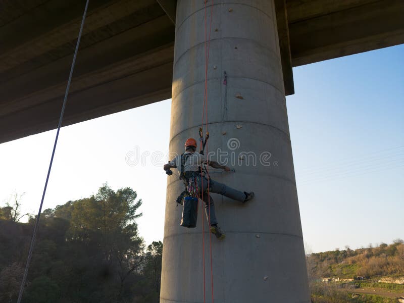 Rope Access Technician Inspecting Bridge Pylon Using Climbing Gear ...