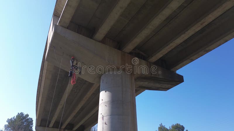 Rope Access Technician Inspecting Highway Overpass Support Beam Stock ...