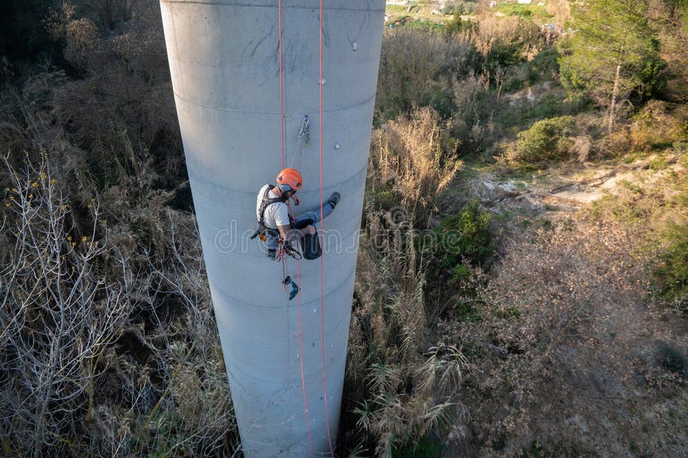 Rope Access Technician Installing Anchorages on Concrete Chimney Stock ...