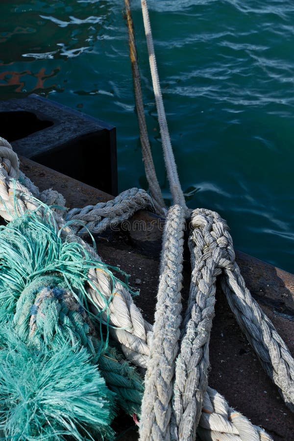 Rope on a Background of Blue Sea. Stock Photo - Image of harbor, knot ...