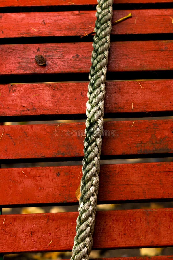 Rope on a Background of Red Boards. Stock Image - Image of boards ...