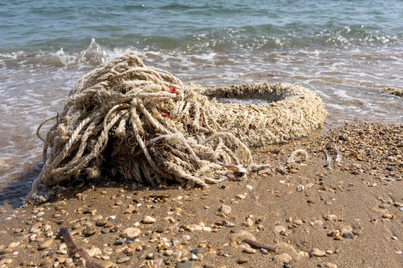 Rope on the Beach with Waves in the Background. Stock Image - Image of ...