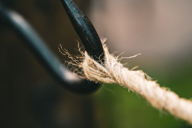 A Rope is Being Pulled by a Hook, and the Rope is Frayed Stock Photo ...