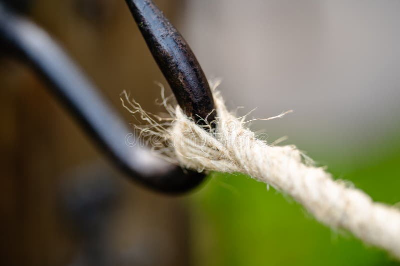 A Rope is Being Pulled by a Hook, and the Rope is Frayed Stock Photo ...